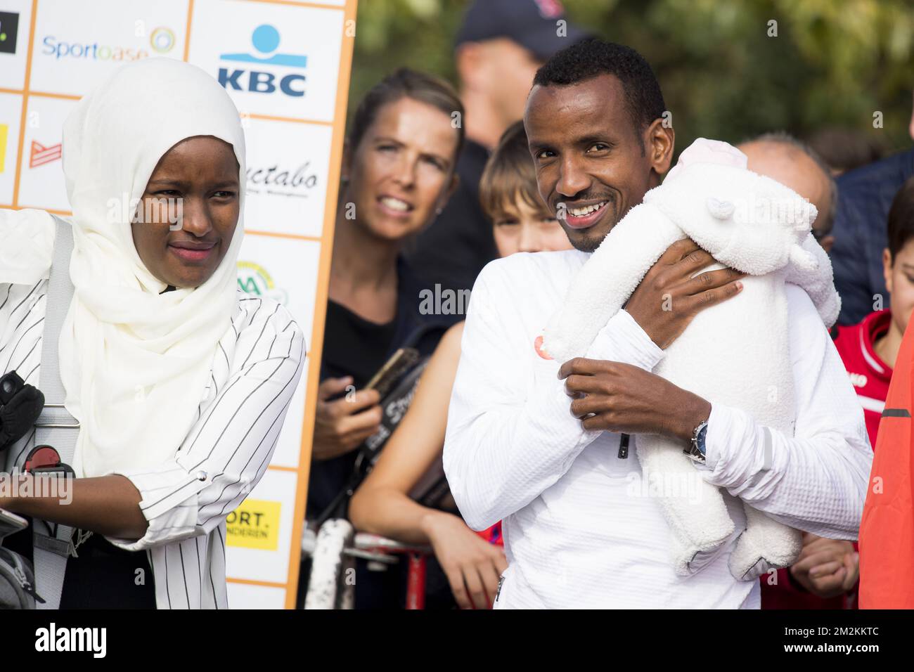 Belgian Bashir Abdi and with his wife and daughter Kadra attend the men's race at the first ...