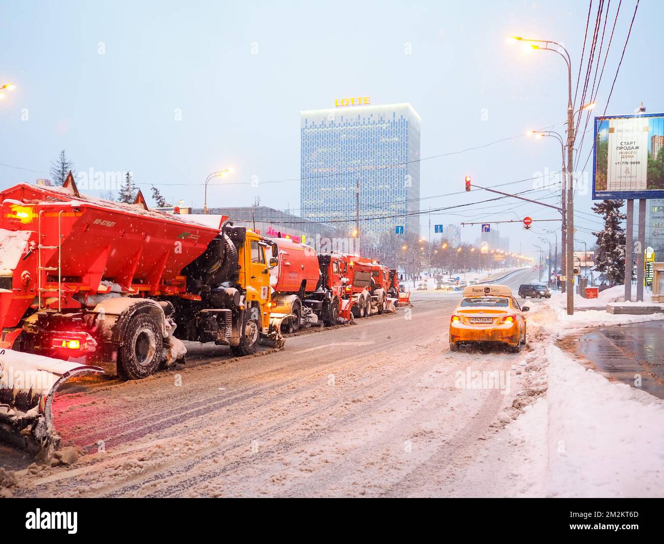 Moscow. Russia. December 14, 2022. Yellow taxi and a column of red ...