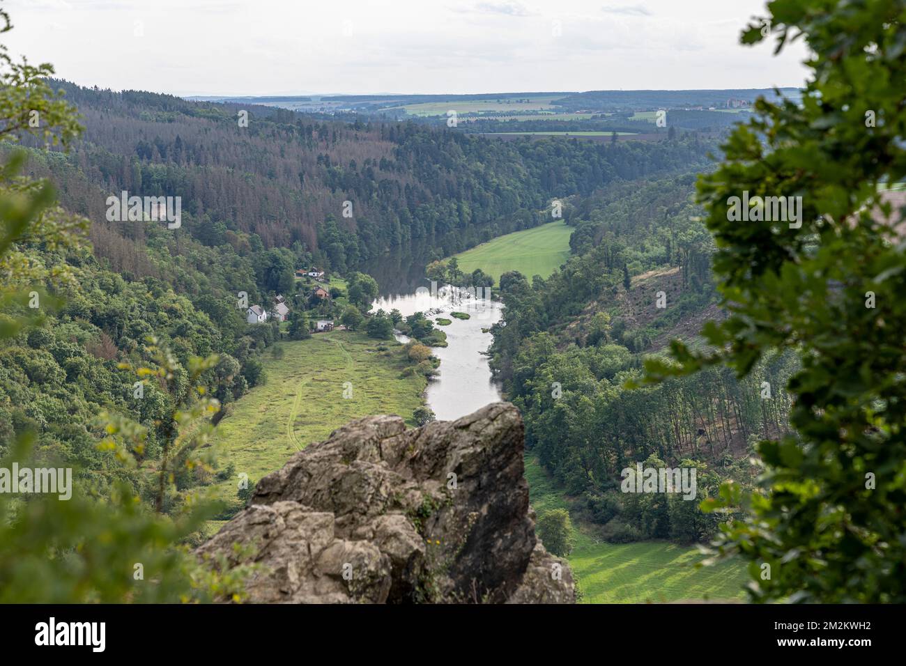 The Berounka river between mountains covered in forests in the Czech ...