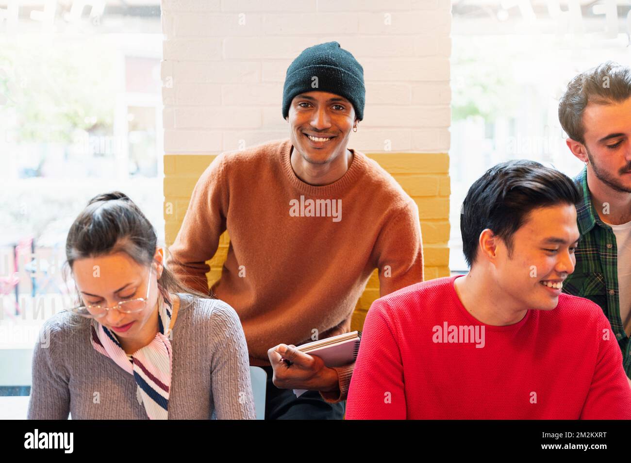 Multiracial group of young people studying together Stock Photo - Alamy