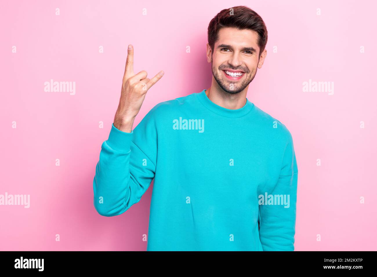 Photo of young positive cheerful handsome guy smiling enjoy his rock ...