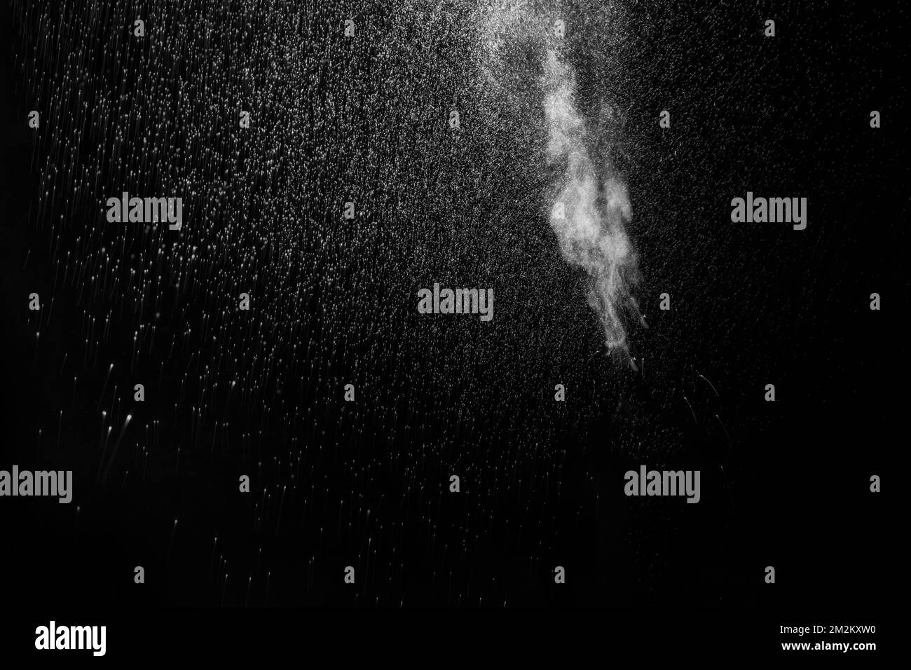 A jet of hot steam with splashes. The movement of hot steam with water ...