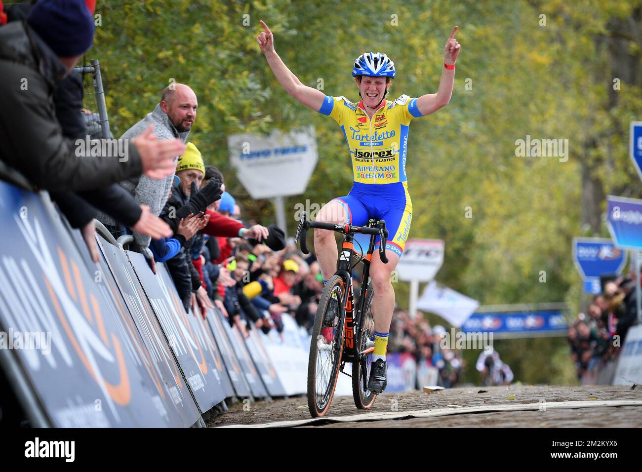 Belgian Kim Van De Steene celebrates as she crosses the finish line to ...