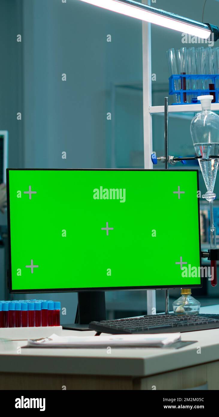 Computer with green screen working in labooratory with mock up monitor ...