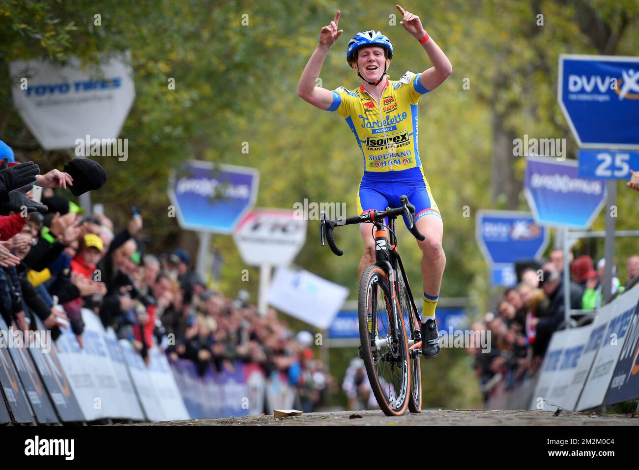 Belgian Kim Van De Steene celebrates as she crosses the finish line to ...