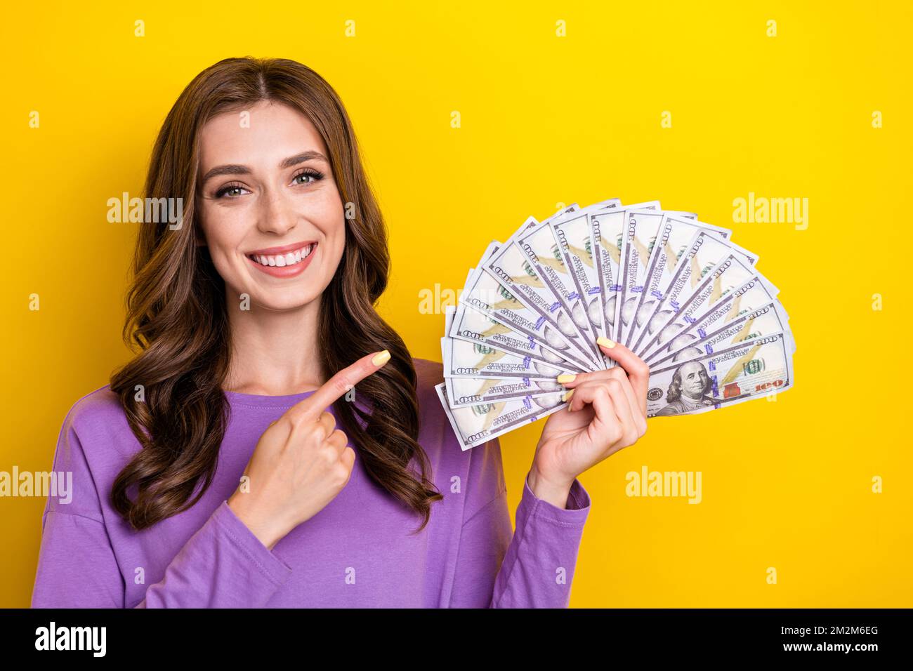 Photo of pretty shiny lady wear violet sweater pointing finger usd cash ...