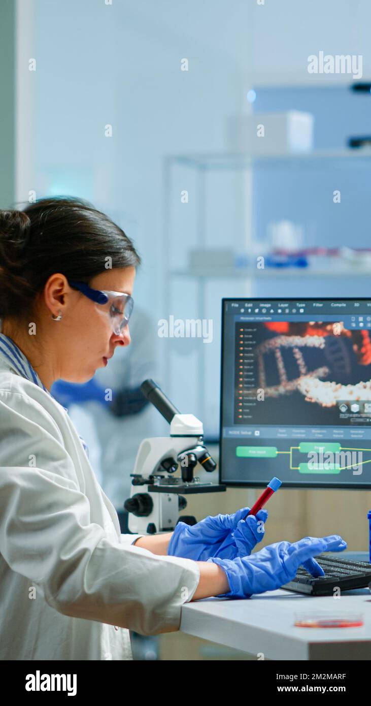 Team of microbiology scientists discussing about virus development in ...