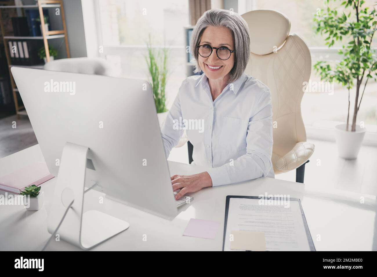 Photo of happy positive lady boss wear white shirt eyeglasses working ...