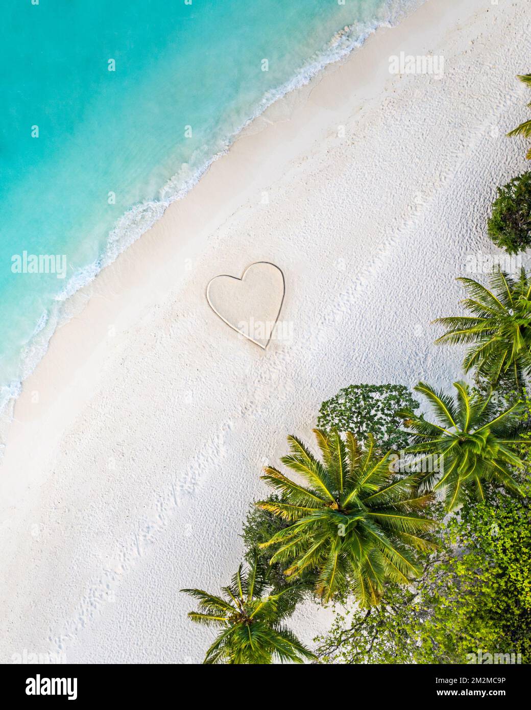 Perfect drawing of heart shape in soft sand beautiful seascape ...