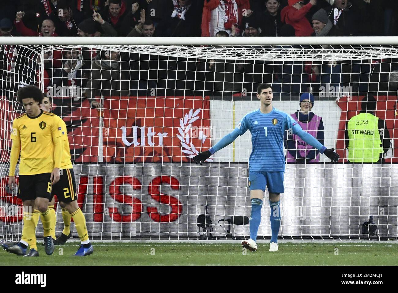 Belgium's Axel Witsel and Belgium's goalkeeper Thibaut Courtois look ...