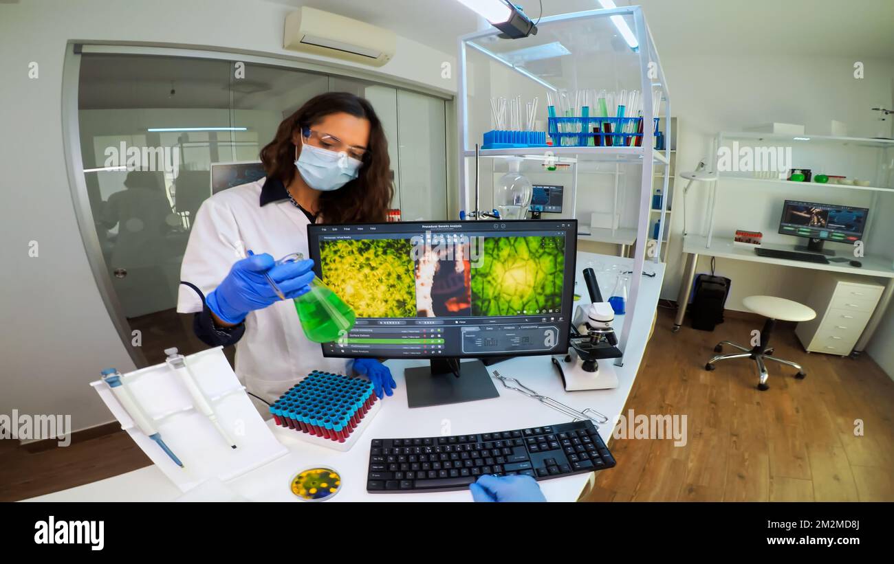 POV of laboratory medical stuff disscussing about vaccine development holding chemical container ...