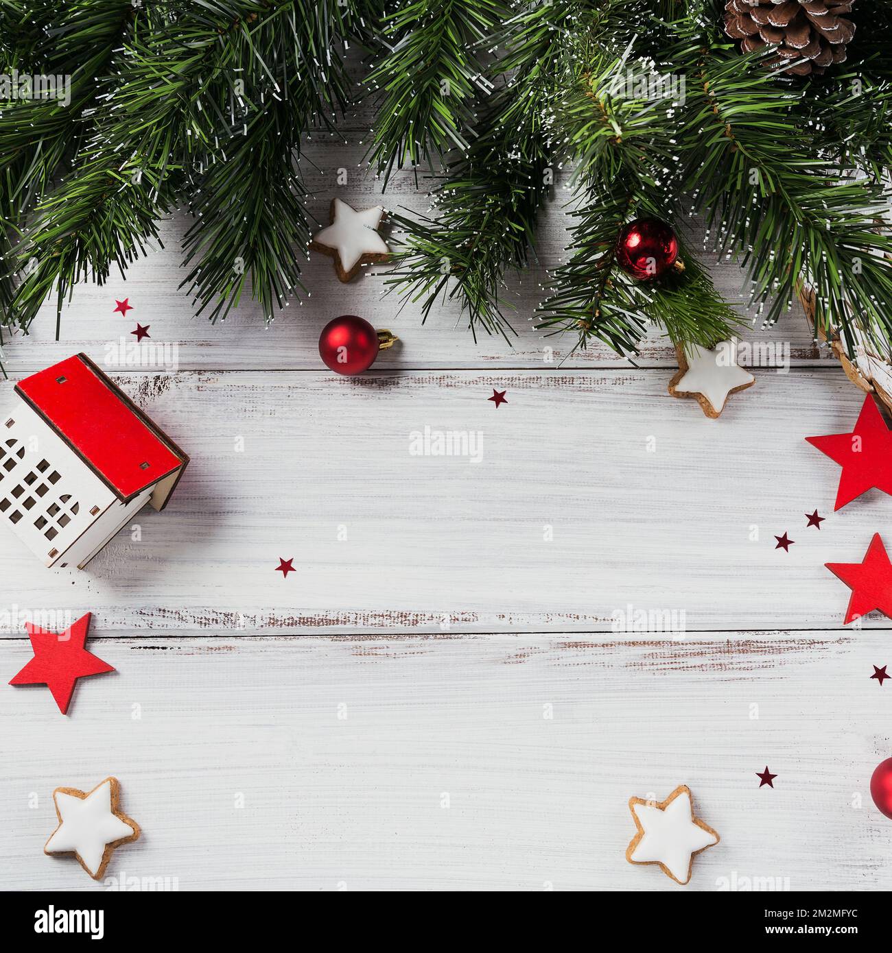 Christmas composition. Gifts, fir tree branches, red decorations on ...