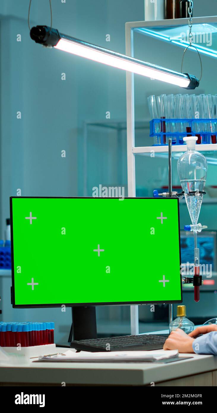 Female research scientist has conversation with man bioengineer next to ...