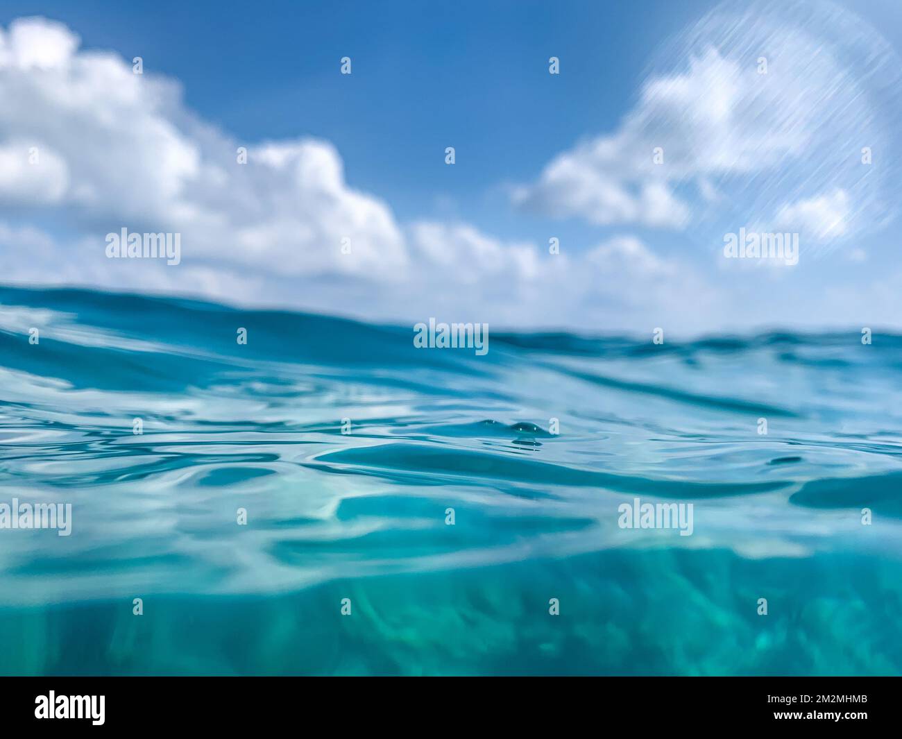 Ocean water background. Soft ripples and waves under beautiful cloudy ...