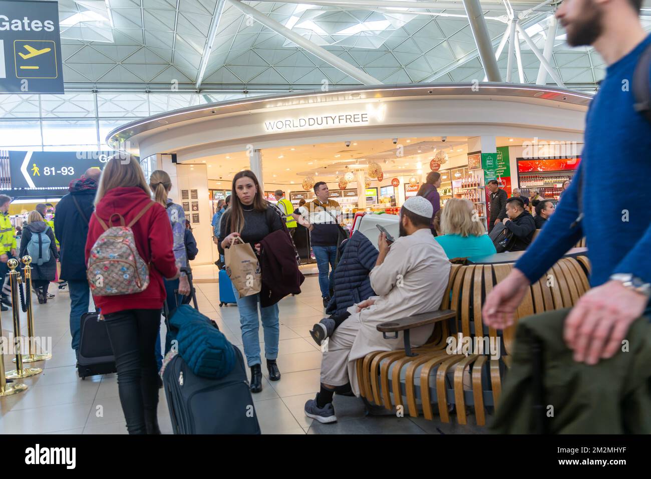 Passengers in departure lounge near World Duty Free shop, Stansted ...
