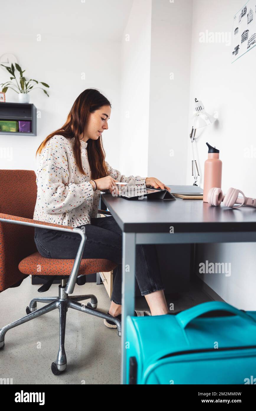 Vertical photo of young medicine college student working for school in ...