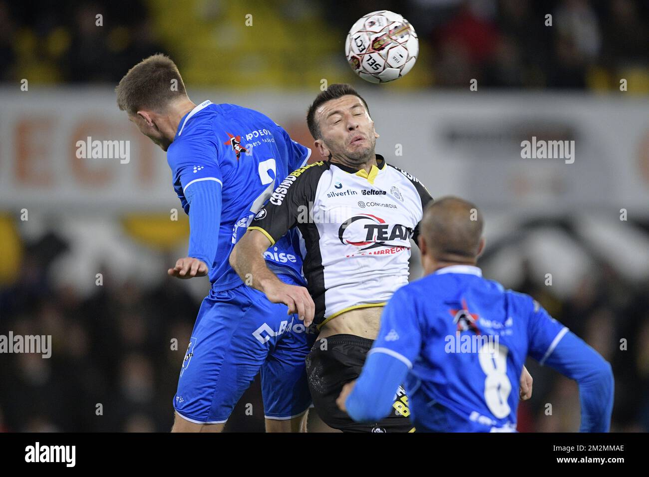 Gent's Arnaud Souquet and Lokeren's Marko Miric fight for the ball ...