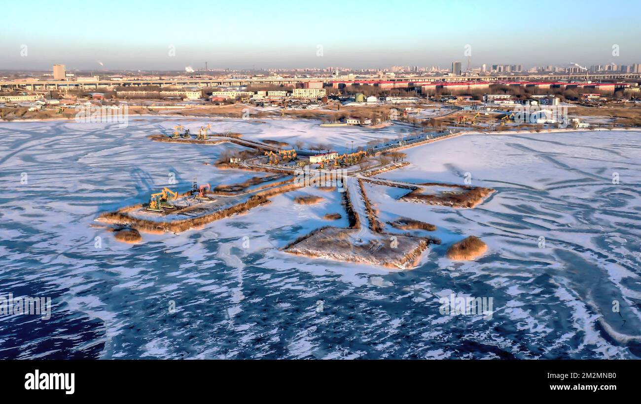 Aerial photo shows the oil extraction site after snow in the Daqing Oil ...