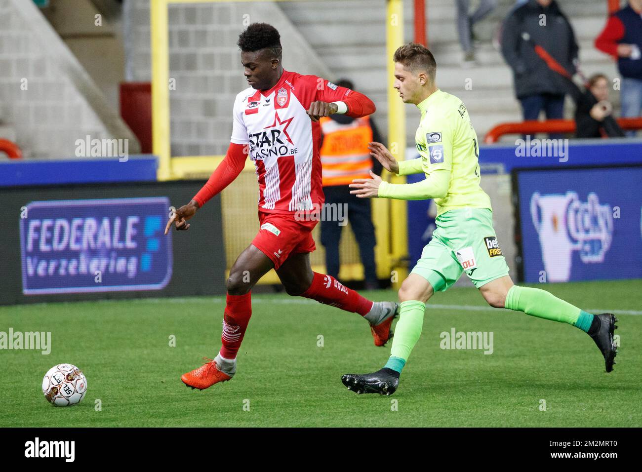 Mouscron's Franck Boya and Oostende's Sindrit Guri fight for the ball ...