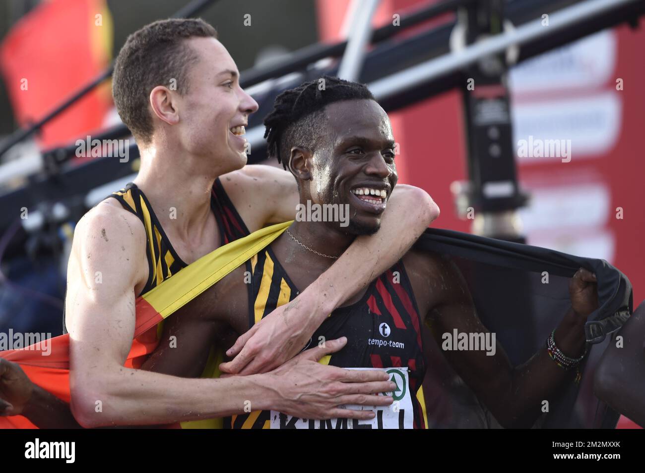 Belgian Robin Hendrix and Belgian Isaac Kimeli celebrate after the senior men race at the ...