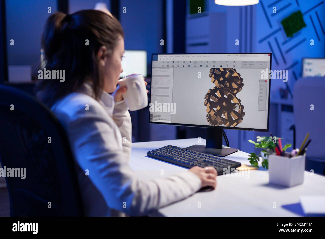 Focused architect working at new project using computer doing gear ...