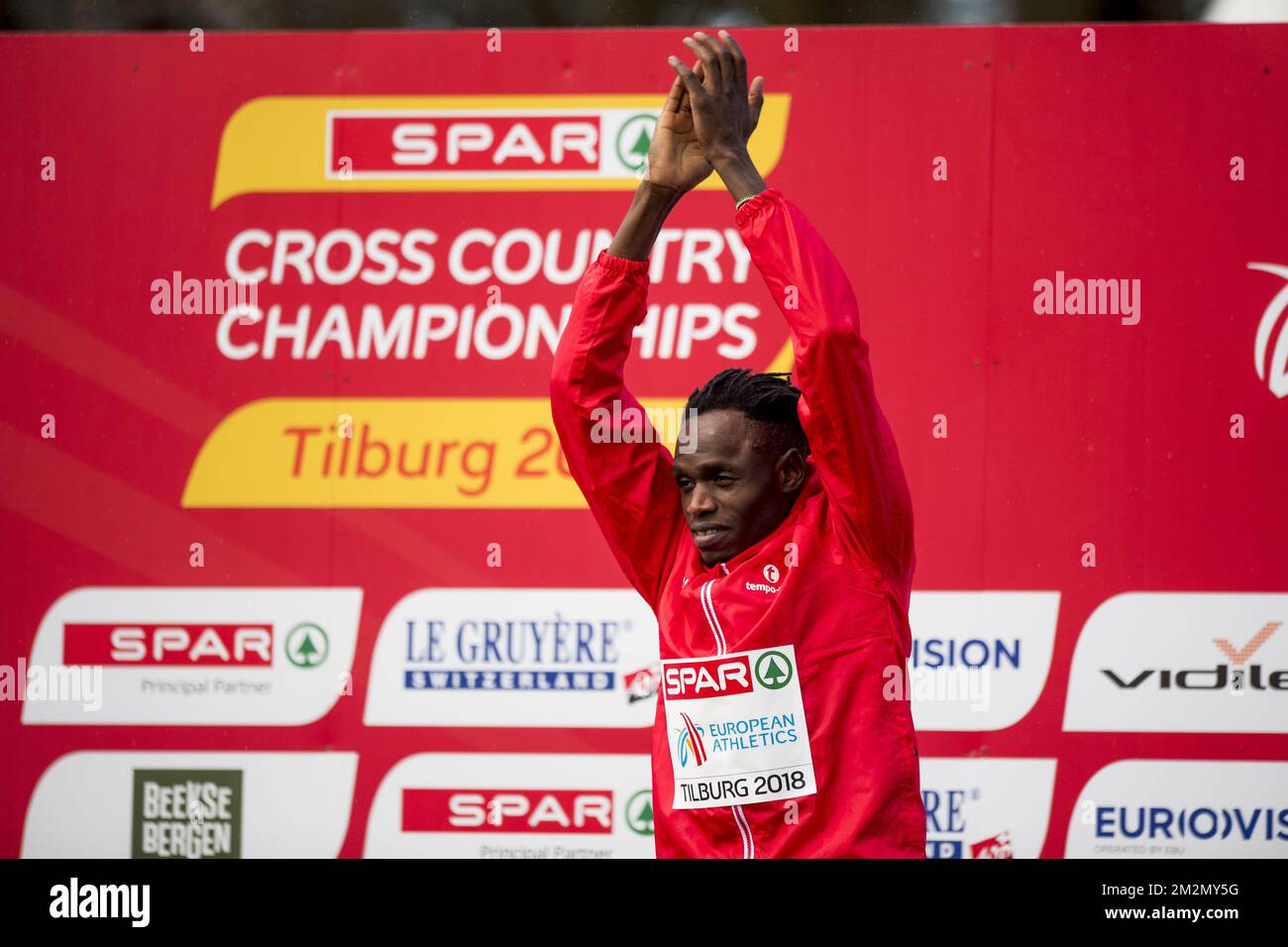 Belgian Isaac Kimeli celebrates on the podium after the senior men race ...
