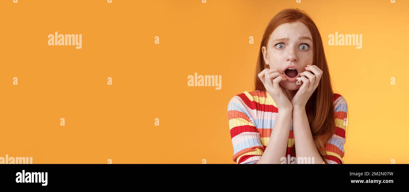 Timid insecure young ginger girl blue eyes feeling scared gasping ...