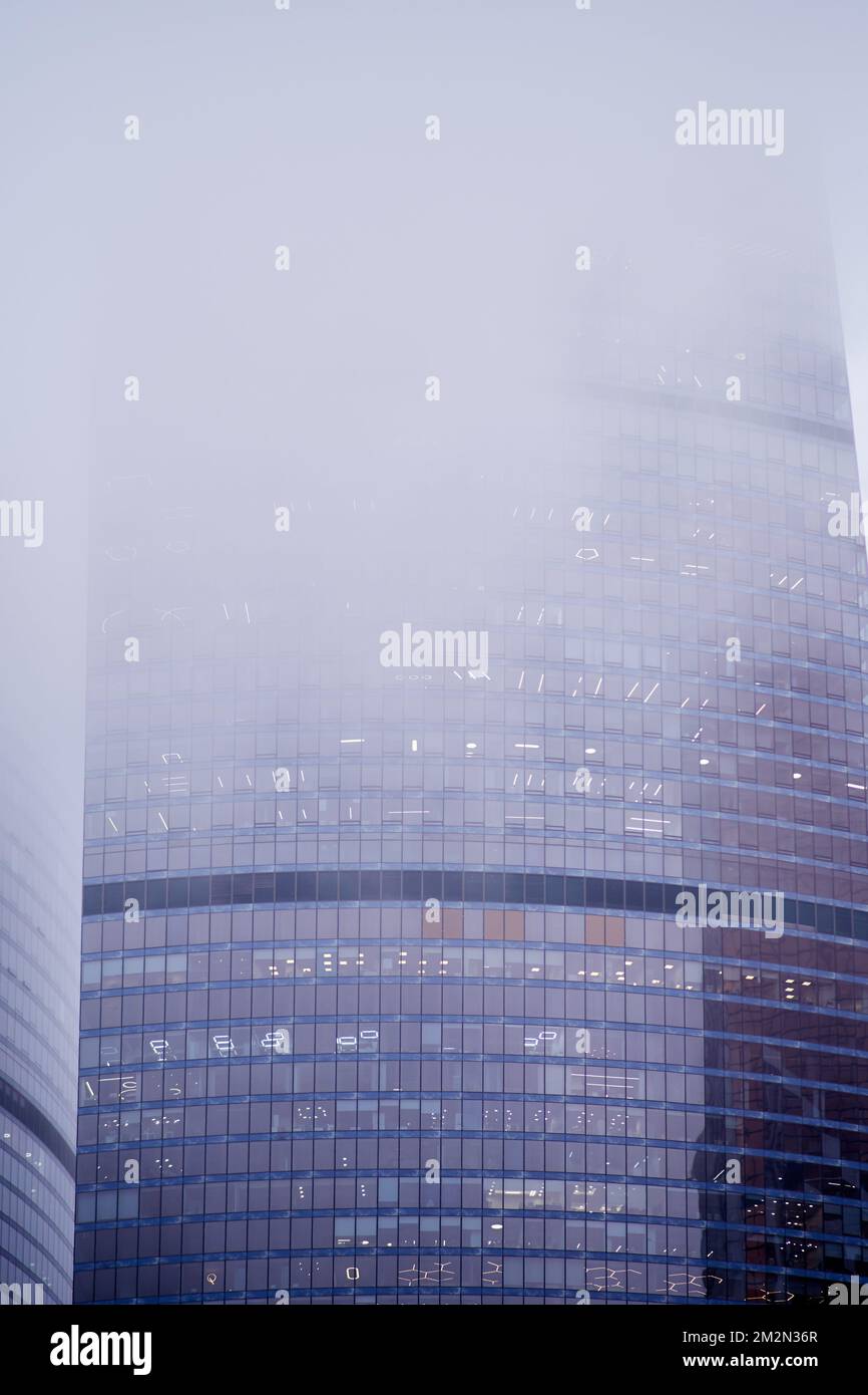 Windows of skyscrapers in the fog, background copy space. Metal ...