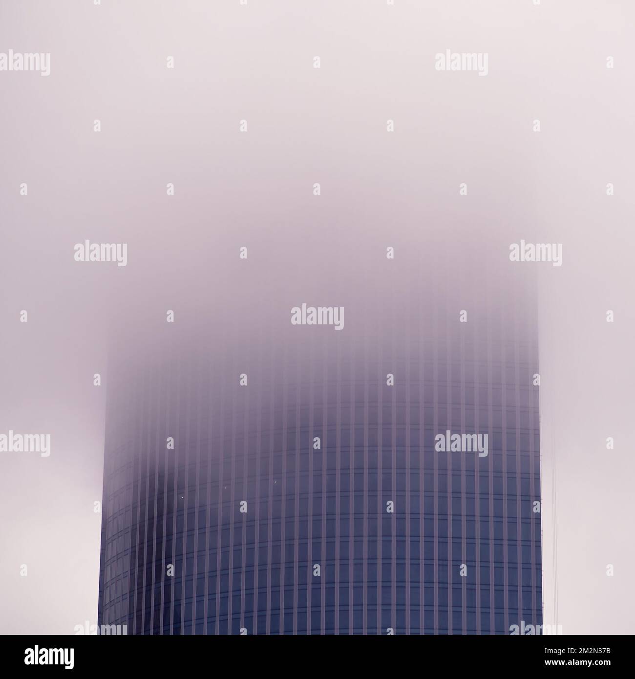 Windows of skyscrapers in the fog, background copy space. Metal ...