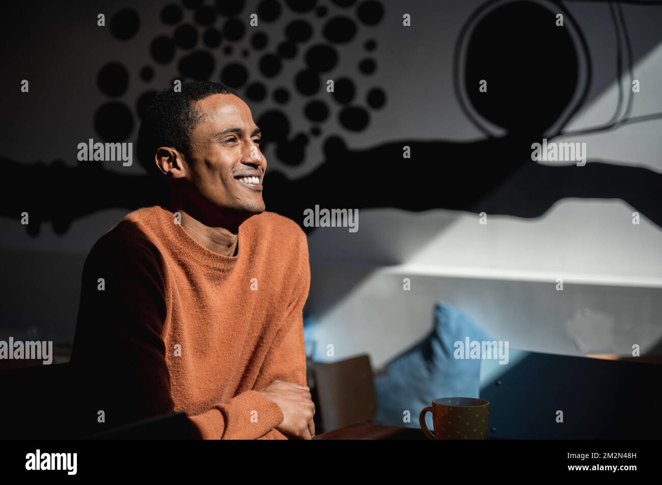 Side view portrait of handsome African young man looking away with ...