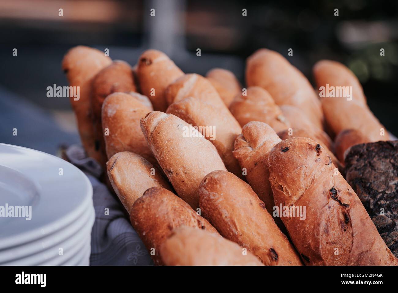 A closeup of loaves of fresh bread in a basket Stock Photo - Alamy