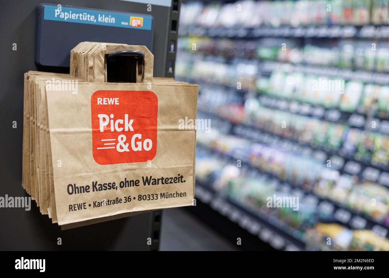 Munich, Germany. 14th Dec, 2022. Paper bags hang on a shelf at the ...