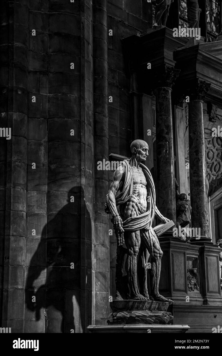 A grayscale of the Statue of St. Bartholomew in Milan Stock Photo - Alamy