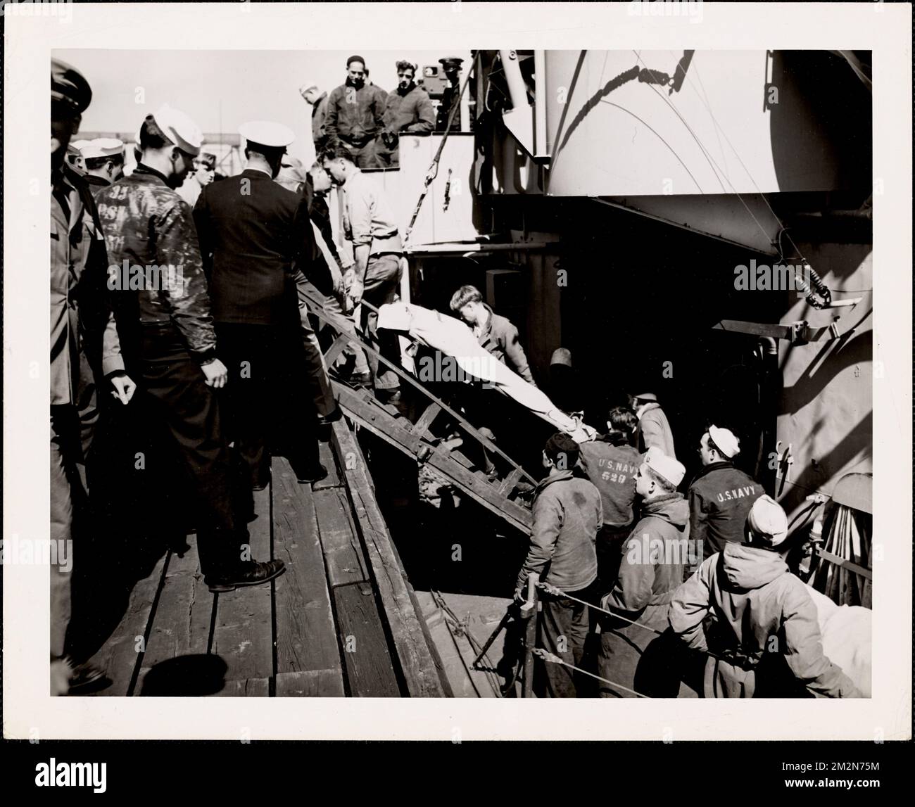 Eagle Boat (PE 56) blew up. Picture shows survivors picked up being ...