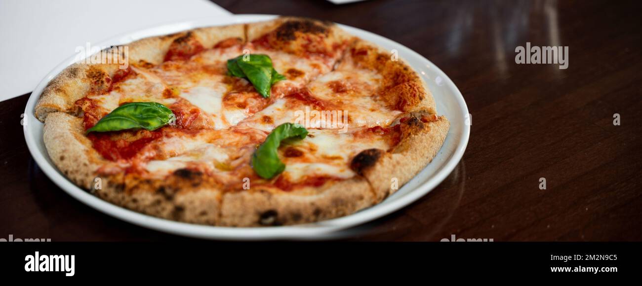 Horizontal banner or header Close-up Italian pizza Margherita on table ...