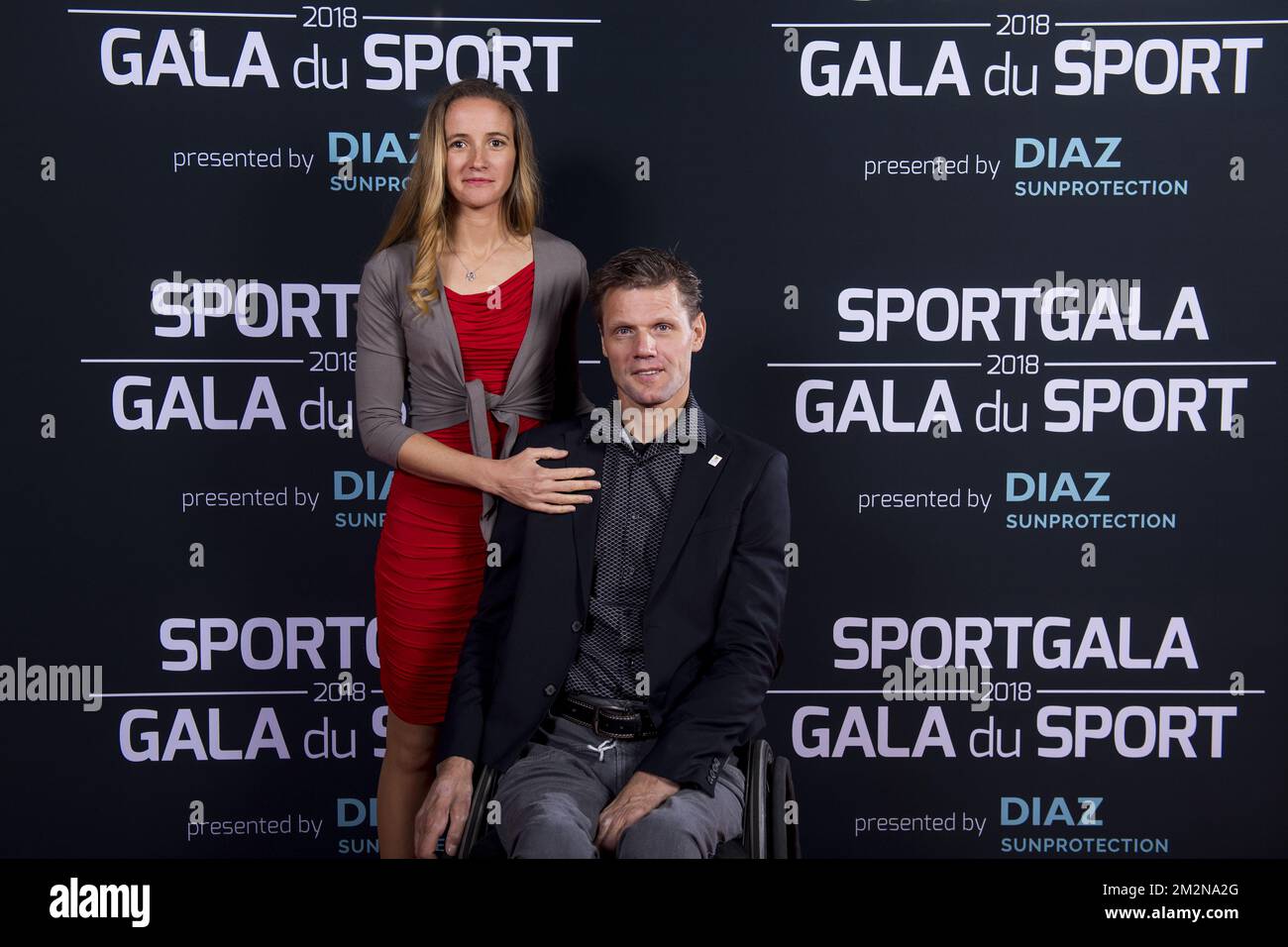 Wheelchair athlete Peter Genyn and his partner pictured on the red ...