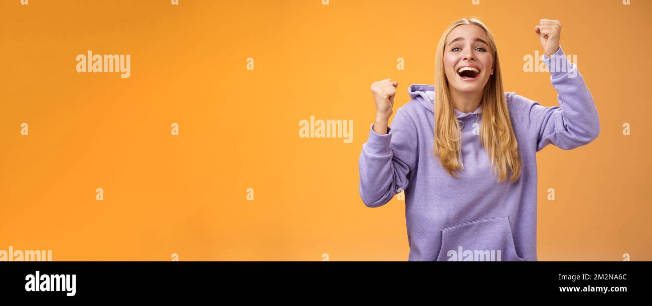 Happy cheerful young supportive woman cheering sister win smiling ...