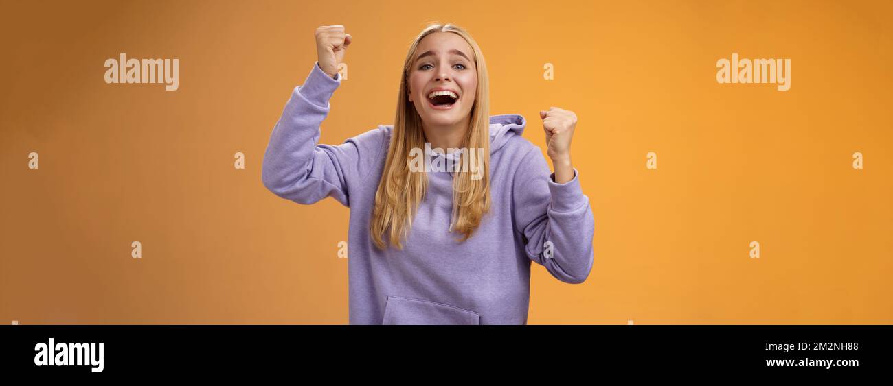 Happy cheerful young supportive woman cheering sister win smiling ...