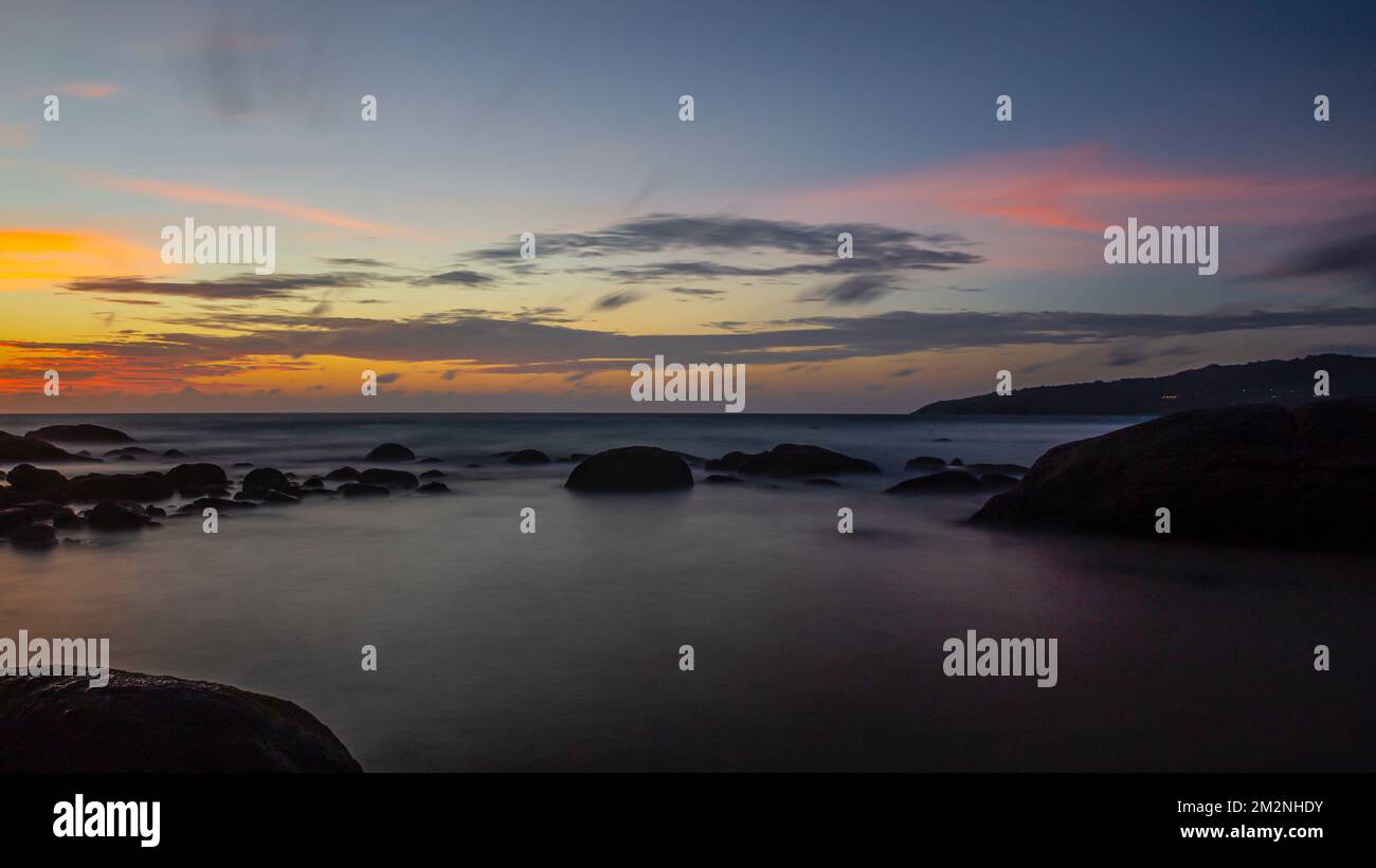 Long exposure picture of colorful sunset at Kamala beach in Thailand ...