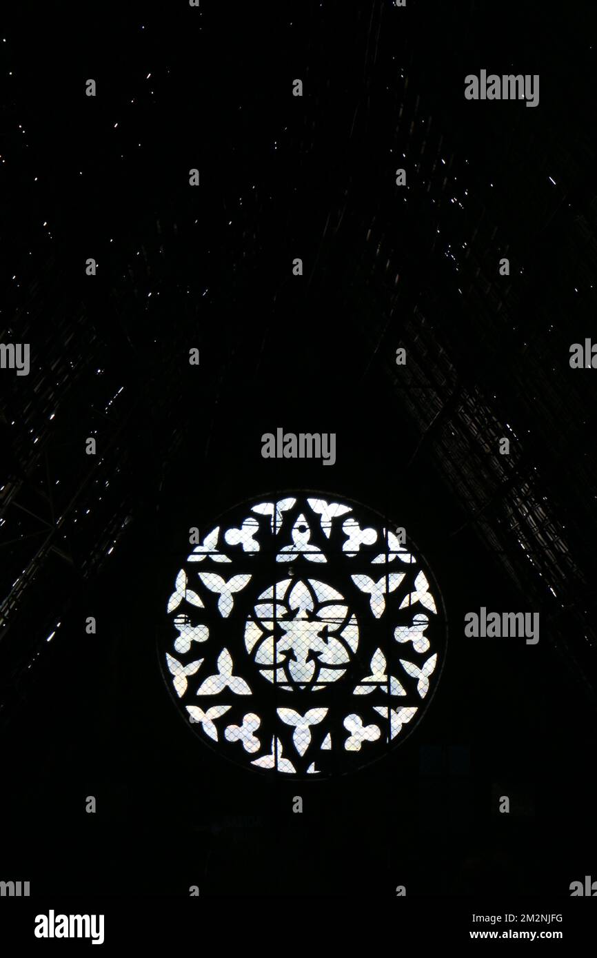 A vertical shot of the luxury interior details of medieval Gothic rose ...