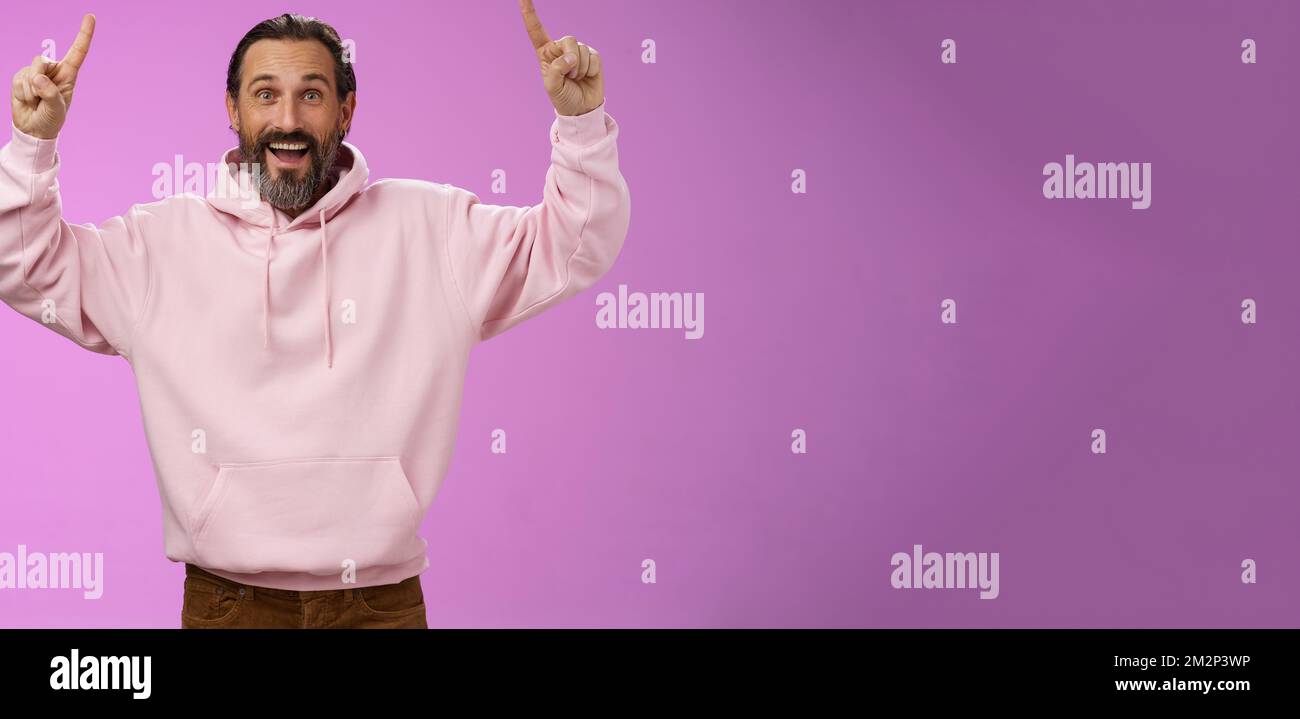 Lucky carefree stylish mature man beard grey hair raising hands ...