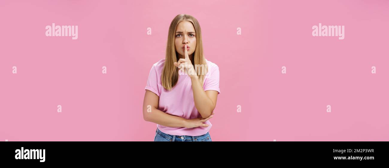 Shh keep voice down. Serious-looking concerned determined female nanny ...