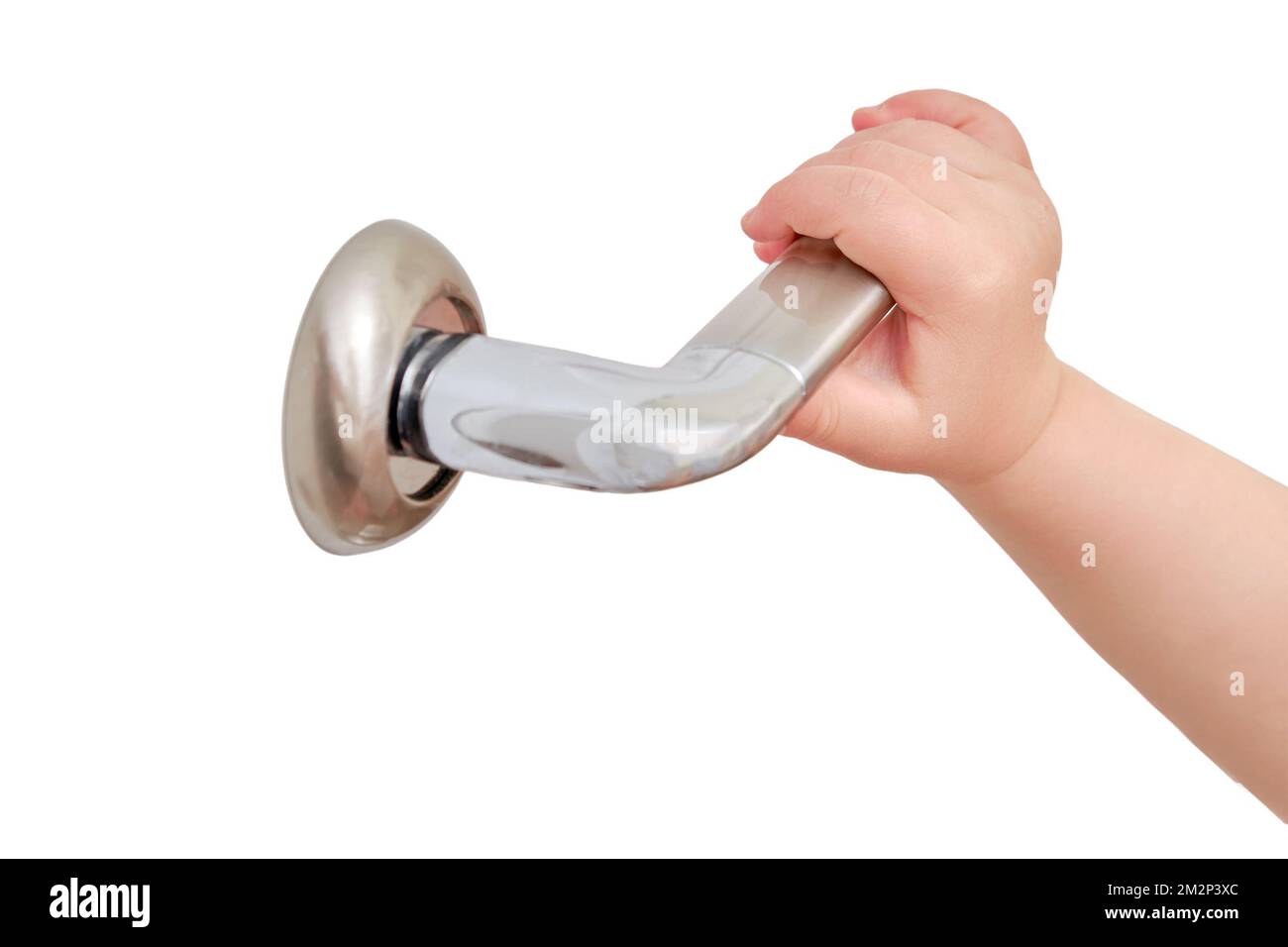 Toddler baby opens the door holding the door handle, child hand close ...