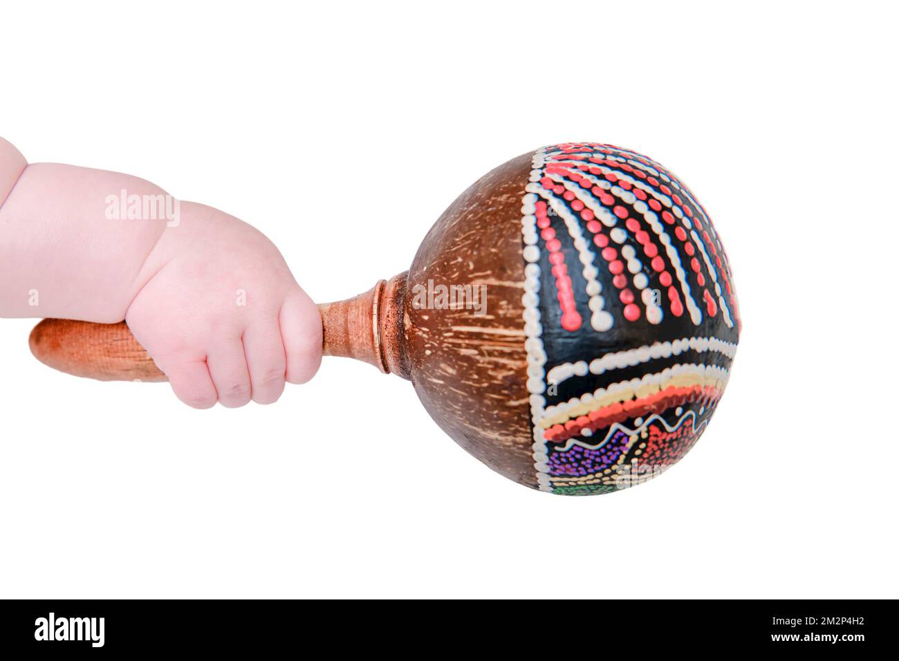 Baby hand and percussion musical instrument, close-up, isolated on a ...