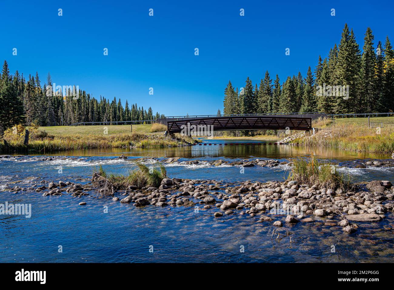 A beautiful view of a bridge over the lake at Prince Albert National ...