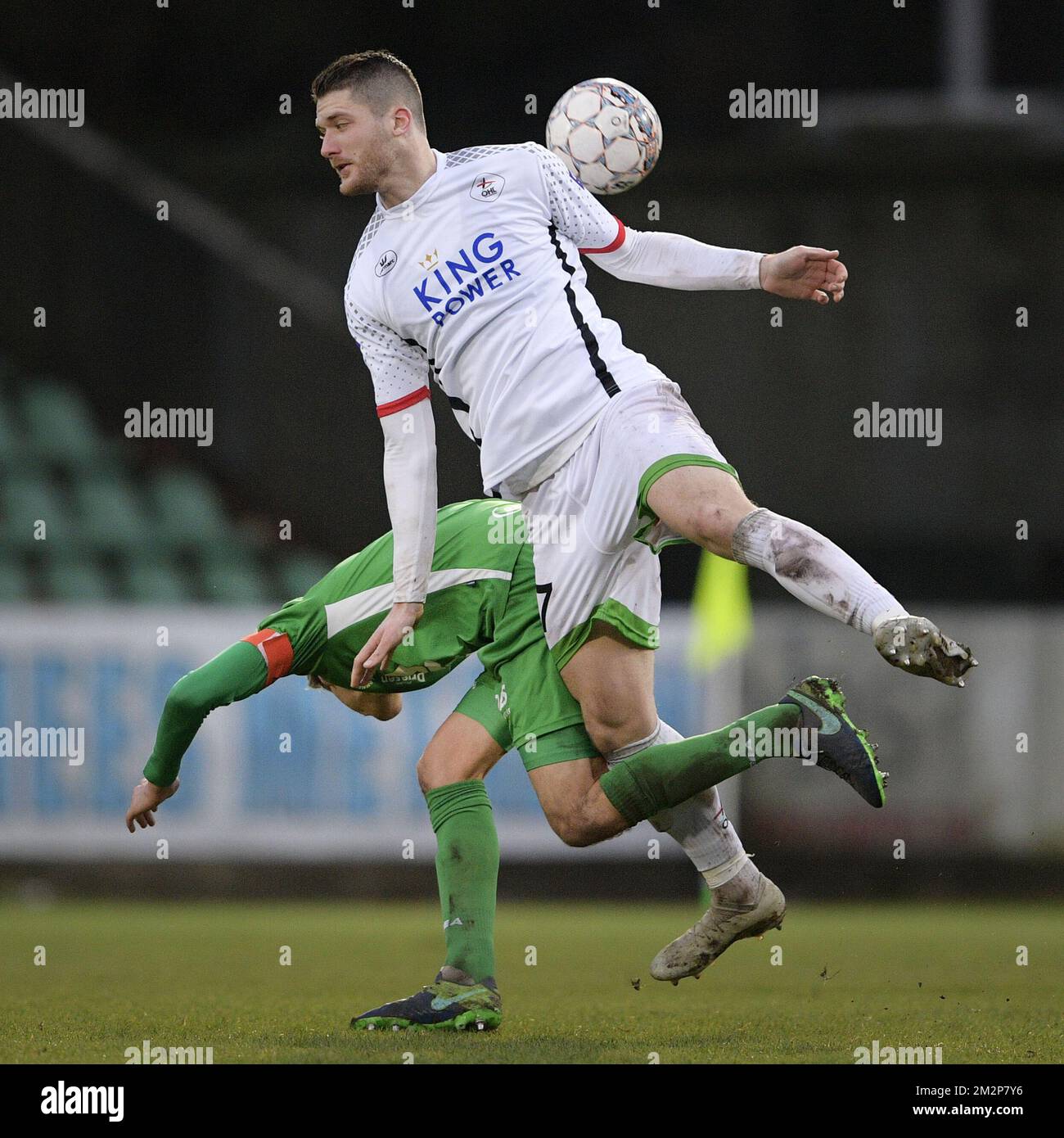 Lommel's Glenn Neven and OHL's Thomas Henry fight for the ball during a ...