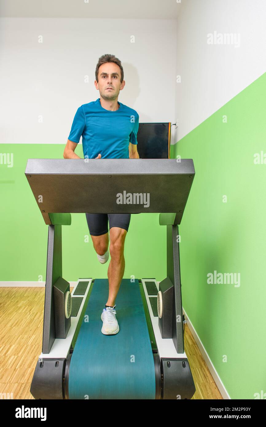 Man Athlete Runs On Treadmill In A Gym Stock Photo - Alamy