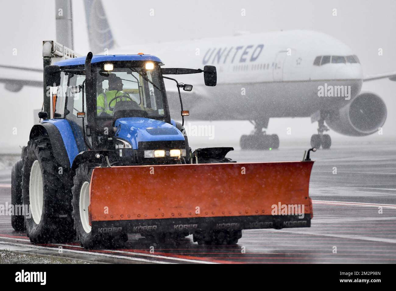 Illustration picture shows a plane and a vehicle to take off the snow ...