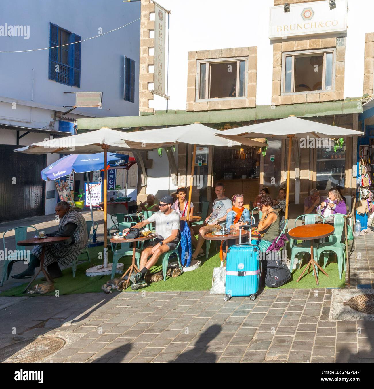 People sitting outside Brunch & Co cafe, in medina area of Essaouira ...
