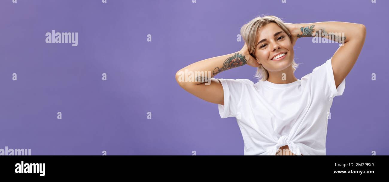 Close-up shot of good-looking stylish and relaxed blond woman with ...